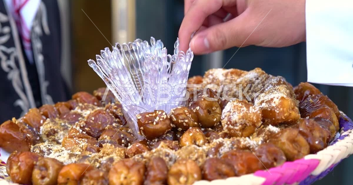 Close-up of a man taking a date in a plastic stick, offering ...