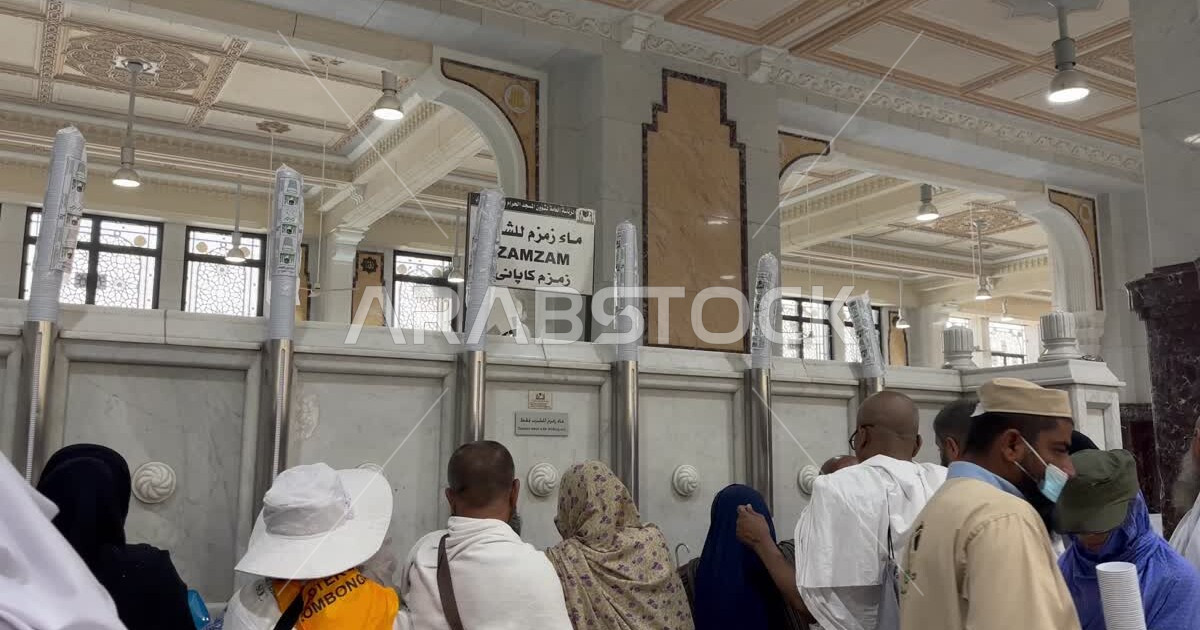 Close-up depiction of pilgrims drinking Zamzam water, striving between ...