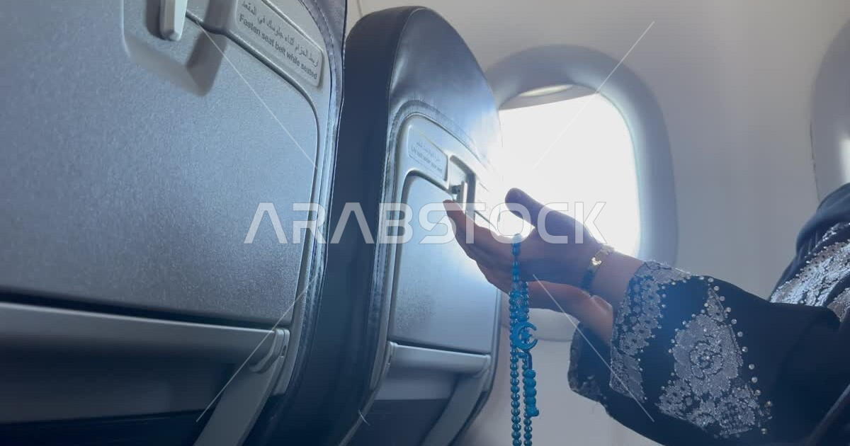 Saudi Airlines, close-up of a Saudi Gulf Arab woman sitting on the ...