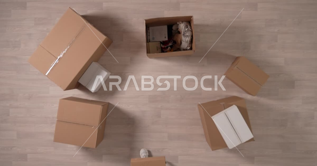 Warehouse keeper carrying a carton box, packing and packaging order ...