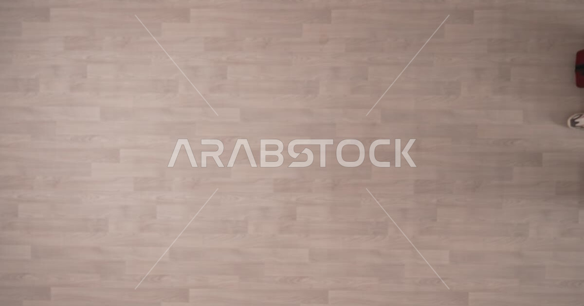 Preparing for travel and tourism, a Saudi Arab Gulf man wearing ...