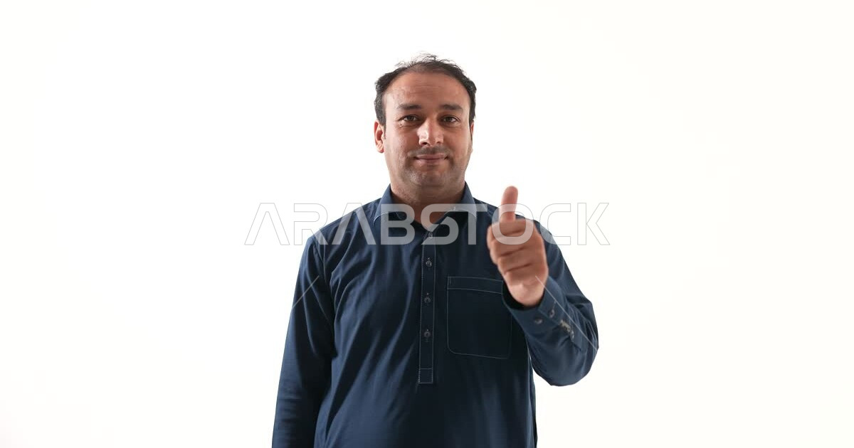 Chroma of a Pakistani man wearing traditional Pakistani dress, raising ...