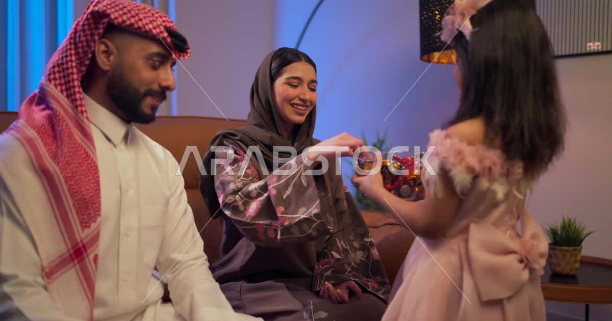 A family gathering of a Saudi Arab Gulf family in the living room, a ...