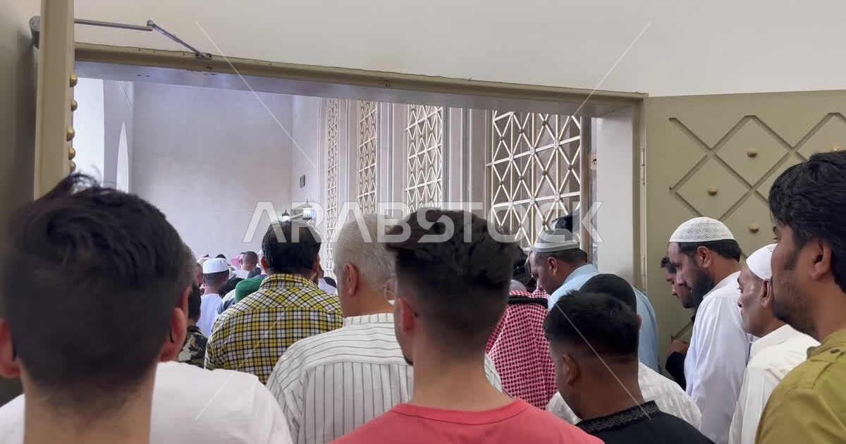 Performing Islamic duties, a group of worshipers leaving the mosque ...