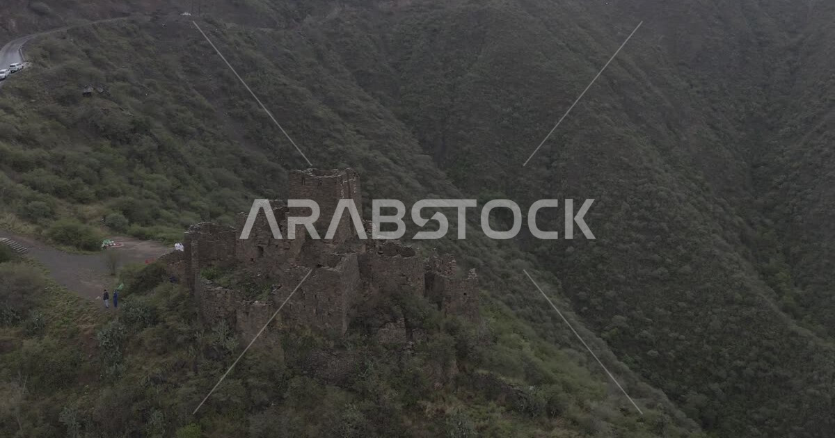Car traffic, Rijal Alma' historical archaeological castle, aerial ...