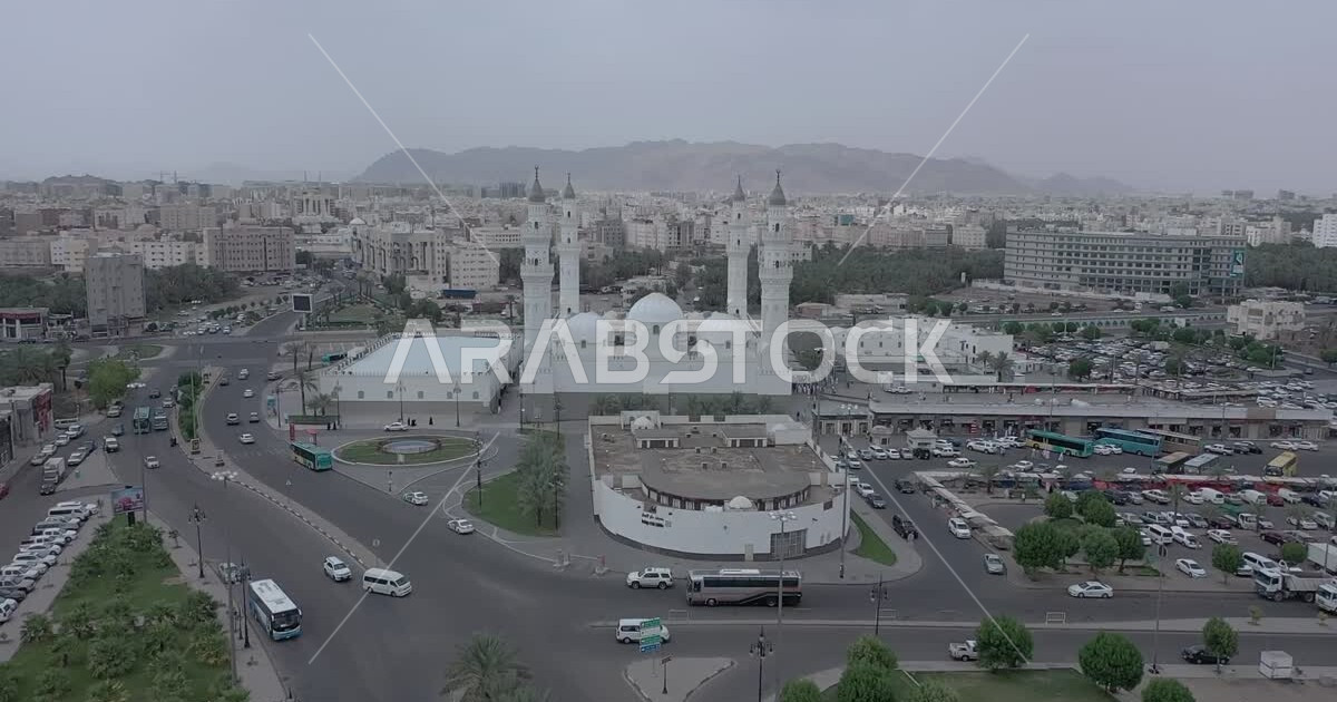 Car traffic in the streets and roads, Quba Mosque in Medina in the ...