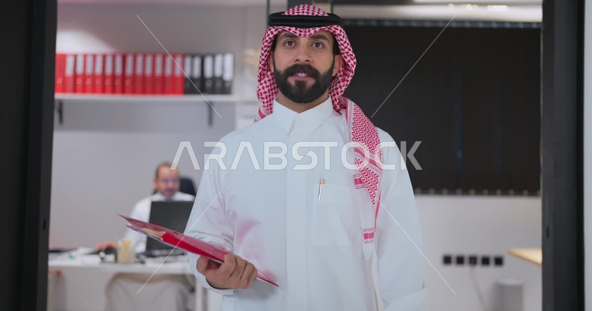 Saudi work environment, a Saudi Arabian Gulf businessman wearing the ...