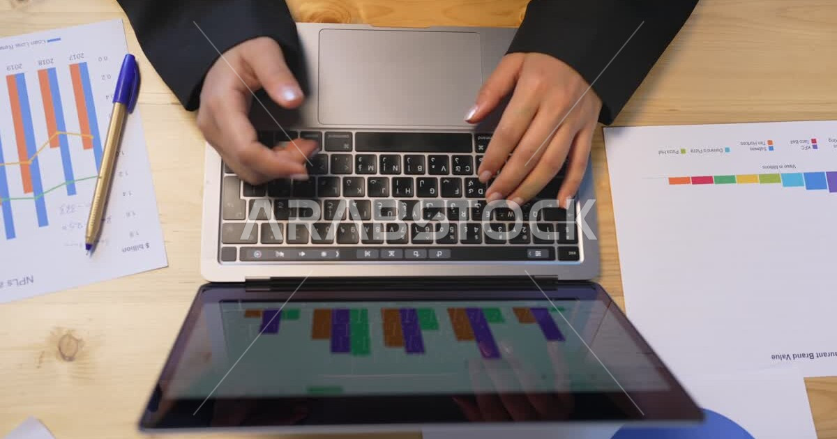 Accomplishment of daily work tasks, a picture from above of an employee ...