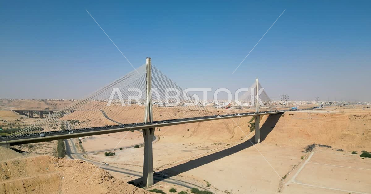 Car traffic, drone photography of the Wadi Laban Bridge supported by ...