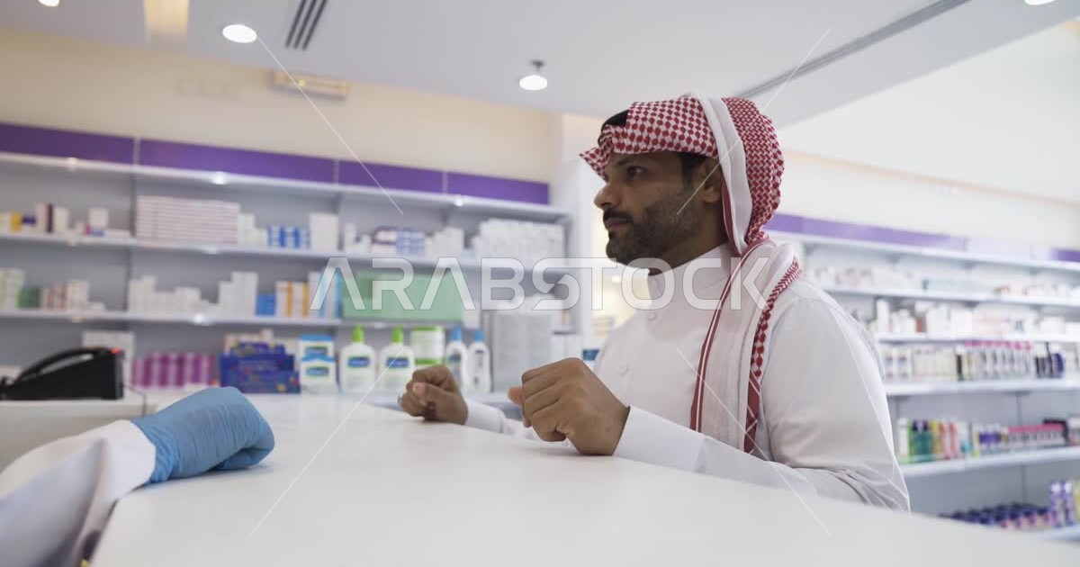 A Saudi Arabian Gulf man inside the pharmacy, buying medicines and ...