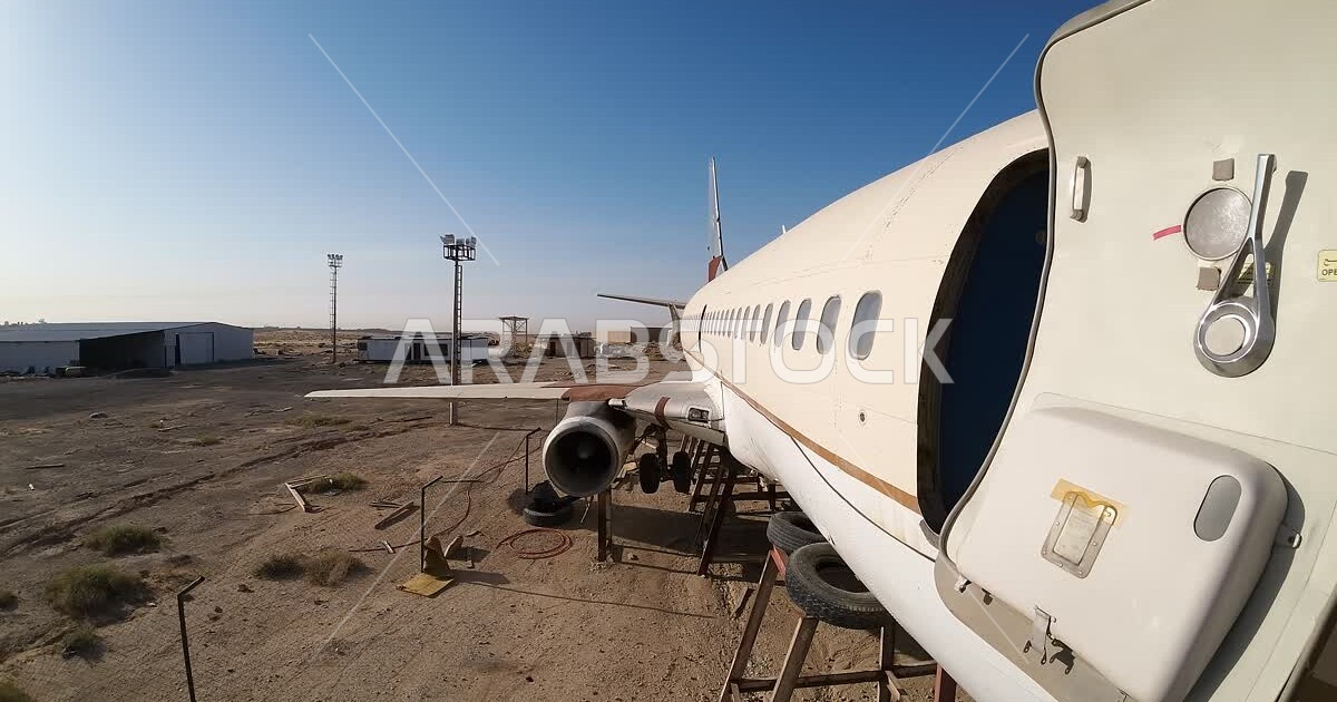 A plane planted in the middle of the desert areas on the Riyadh-Qassim ...