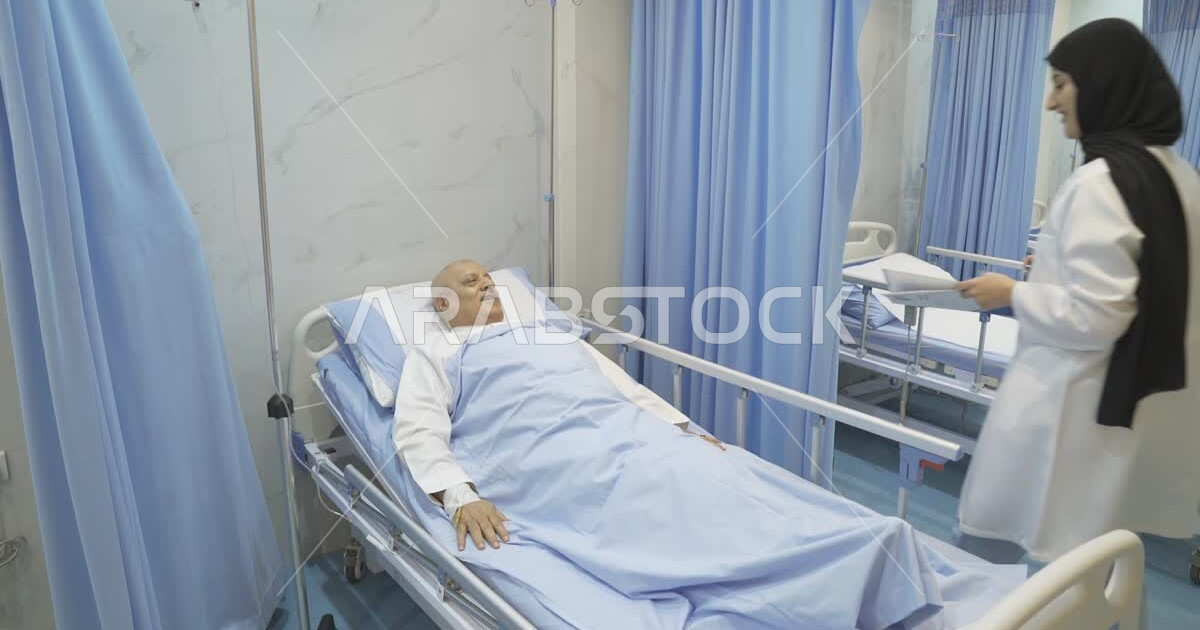 An old man, Arab, Gulf, Saudi, patient lying on a hospital bed ...