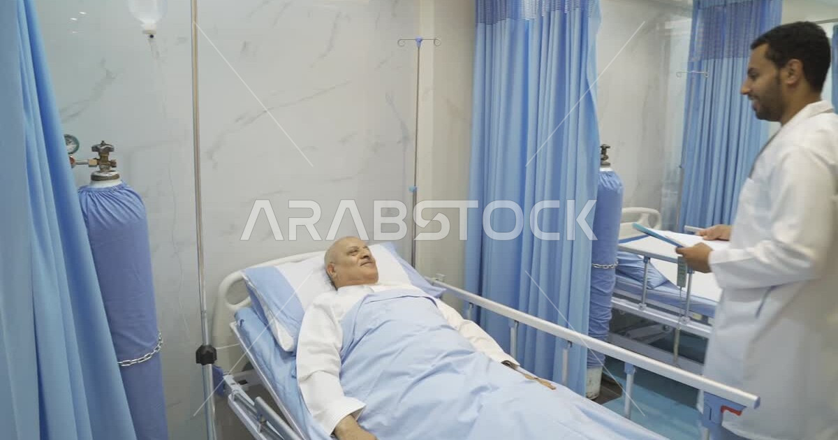 An old man, Arab, Gulf, Saudi, patient lying on a hospital bed ...