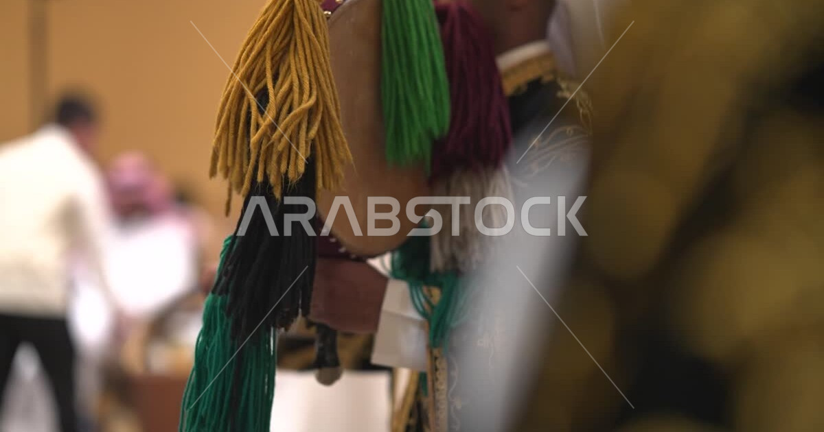 A close-up of a Saudi Arab Gulf man playing a drum, Saudi folklore arts ...