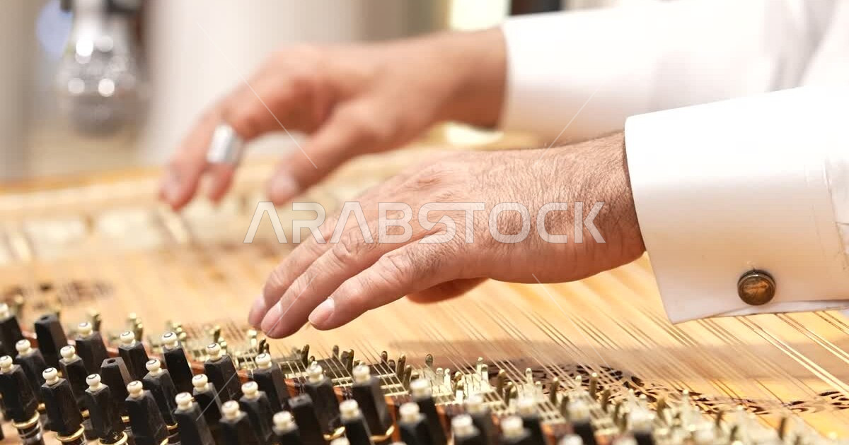 The use of stringed musical instruments, a close-up of the hand of a ...