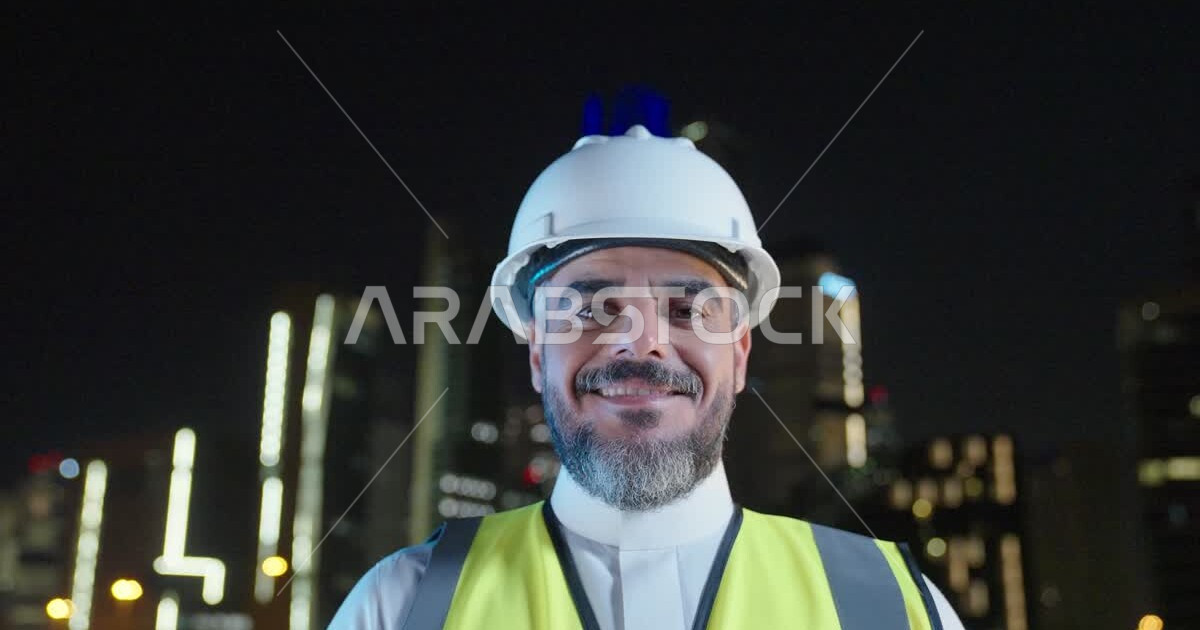 Construction and architecture, a smiling Arab Gulf Saudi engineer ...