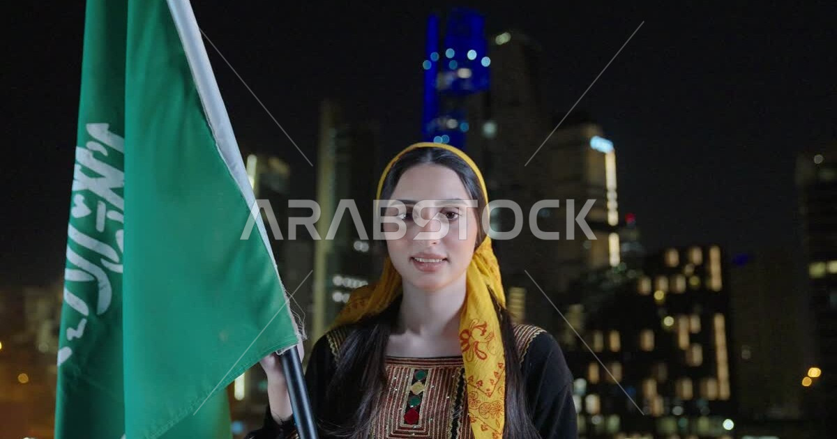 Saudi National Day 93, a Saudi Arabian Gulf woman wearing a shayla and ...