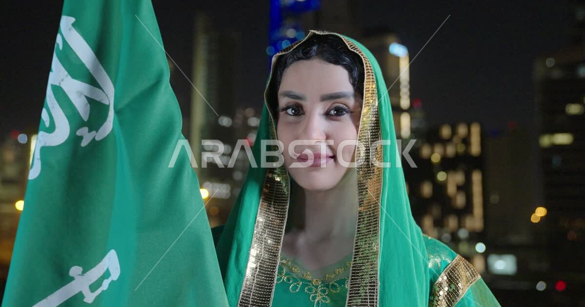Pride in the Saudi national identity, a Saudi Gulf Arab woman wearing ...