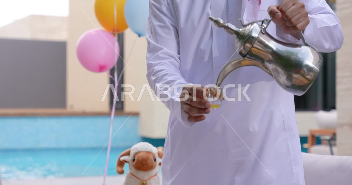 A close-up depiction of a Saudi Gulf Arab man serving coffee to guests ...