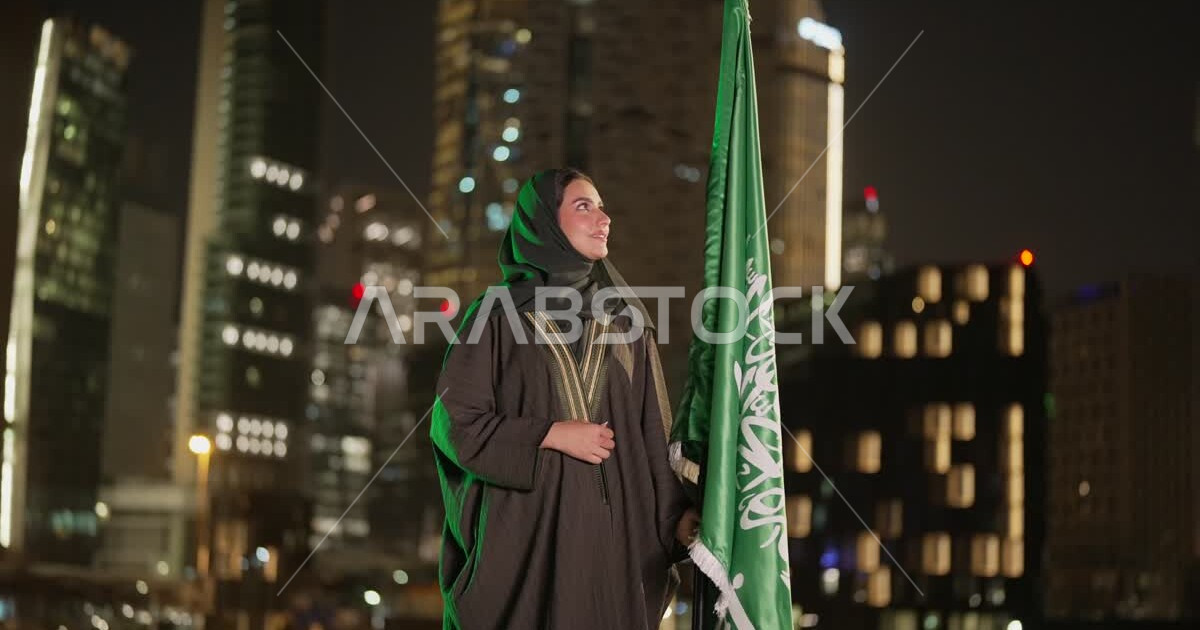 Saudi Flag Day March 11th, close-up of a veiled Saudi Gulf Arab woman ...