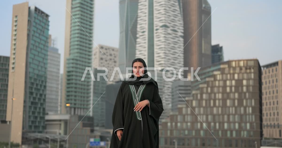 Standing confidently and looking at the camera, the background of the ...