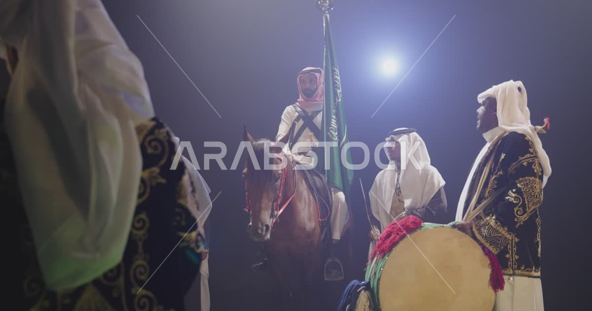 Raising the flag of the Kingdom of Saudi Arabia, celebrating with ...