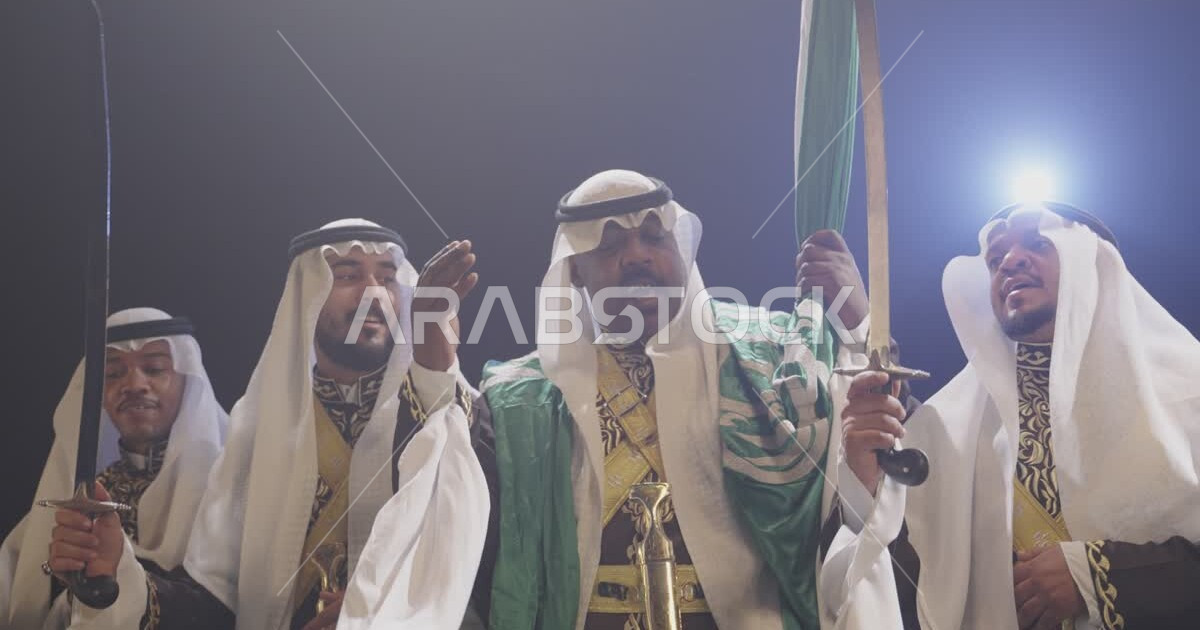 Saudi National Day, folk dancing with swords in the Najdi Ardha ...