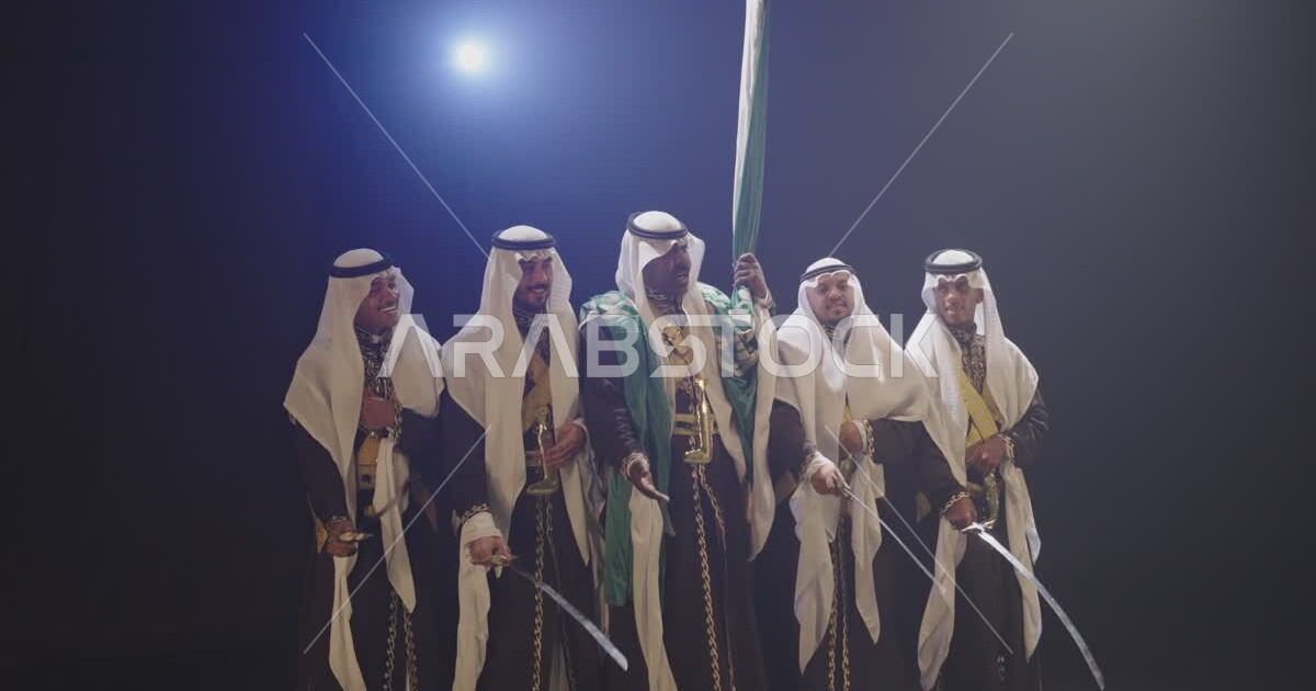 Folk dance with swords in Al-Ardah Al-Najdiyeh, wearing the folk ...