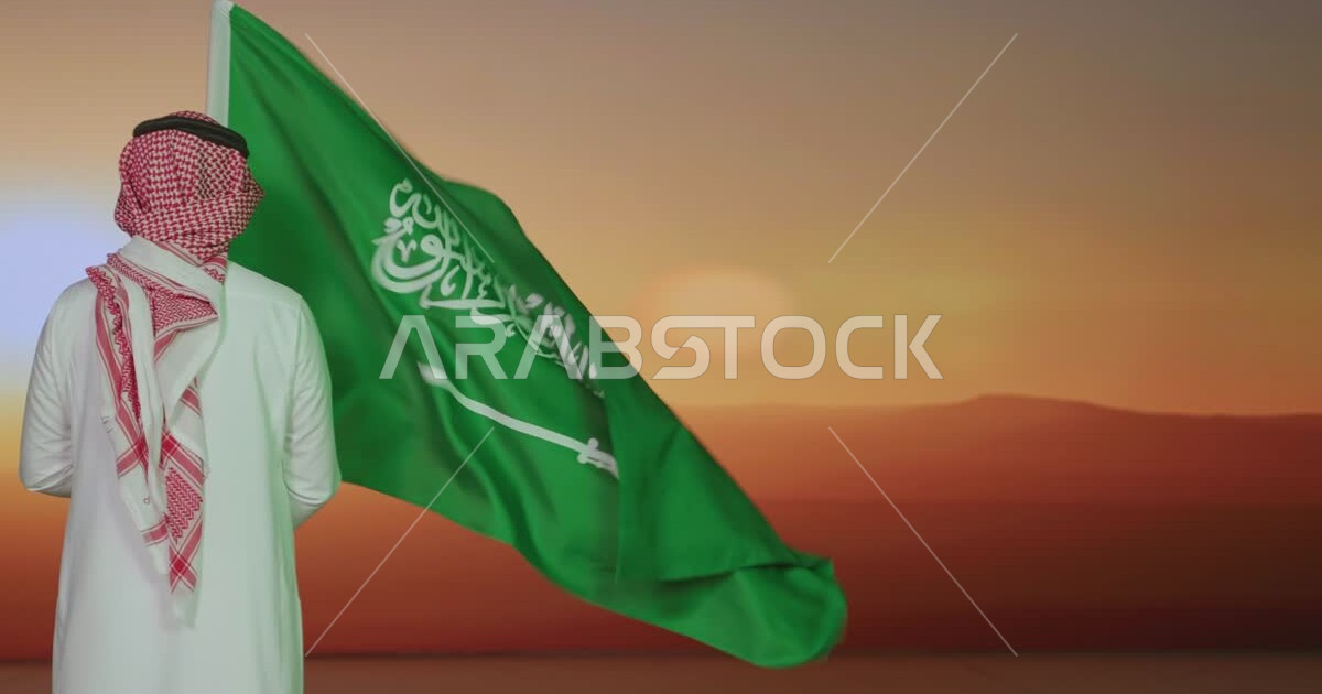Devotion and belonging to the homeland, a view from behind of a Saudi ...