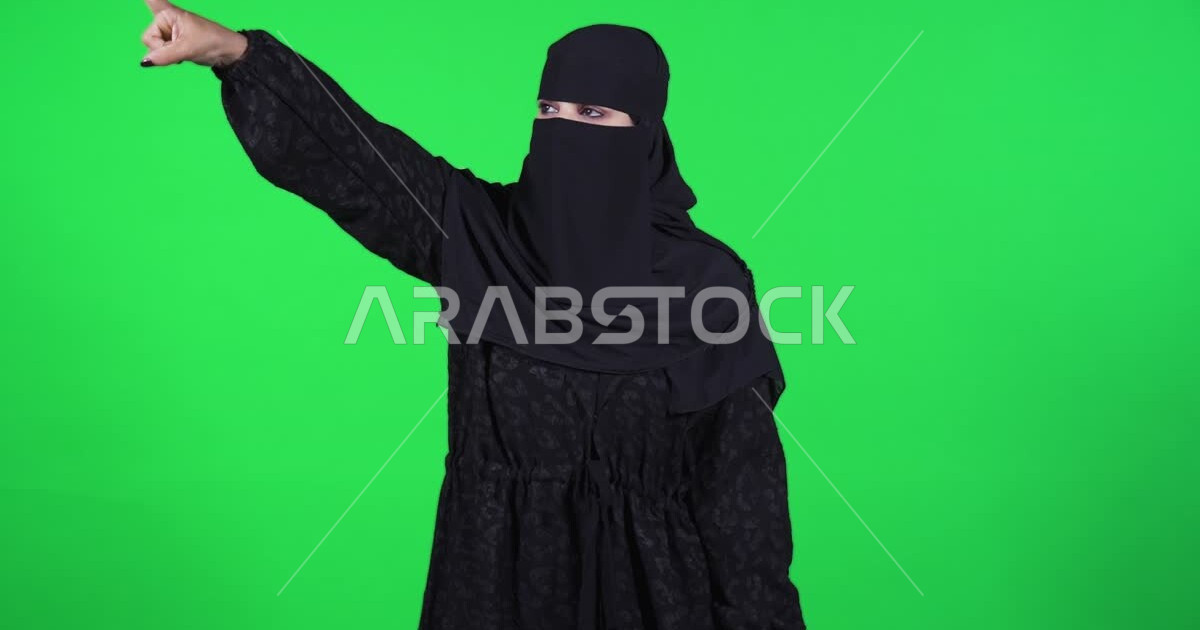 Chroma of a veiled Saudi Arabian Gulf woman, wearing a black abaya ...