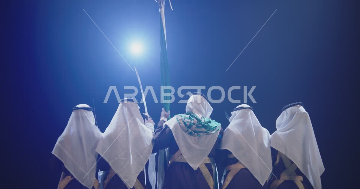 Wearing Najdi Ardha costumes, folk dances with swords on national ...