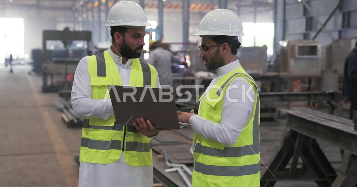 Two Gulf Arab and Saudi engineers inside the steel factory, checking ...