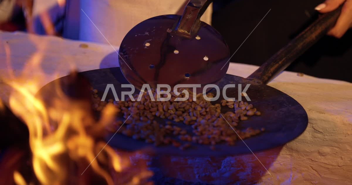 Desert life in the Saudi deserts, roasting coffee with enthusiasm over ...