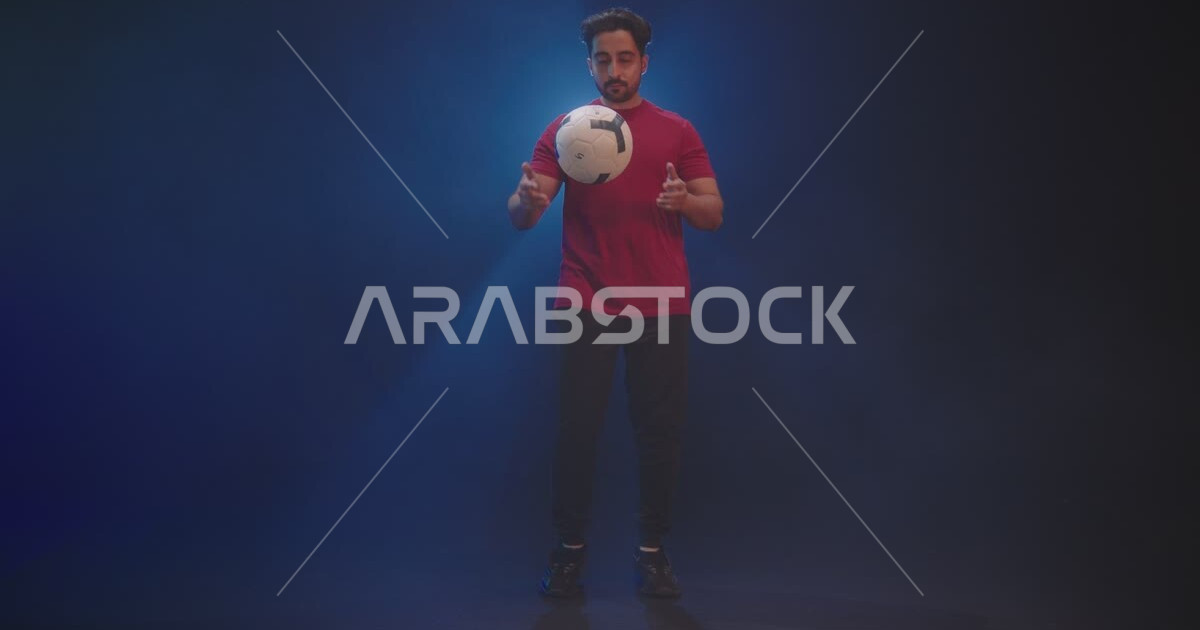 Practicing football and practicing its skills, a young Saudi Arabian ...