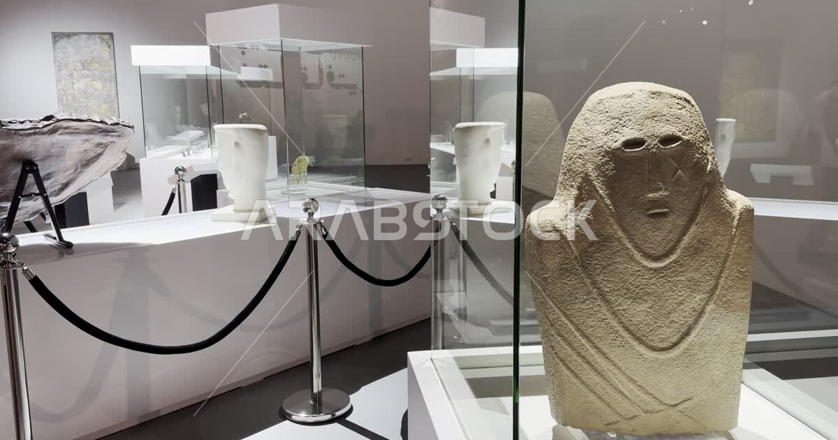 A close-up of a historical human statue displayed in an exhibition ...