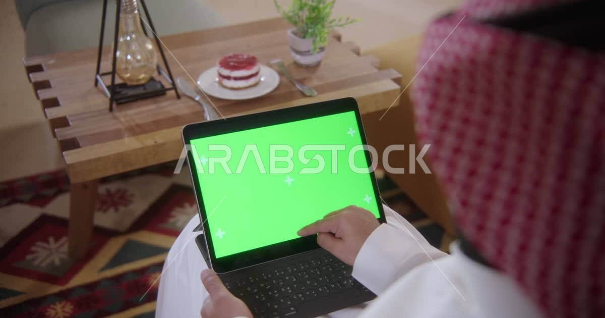 Clicking and tapping on a blank green screen, using modern devices and ...