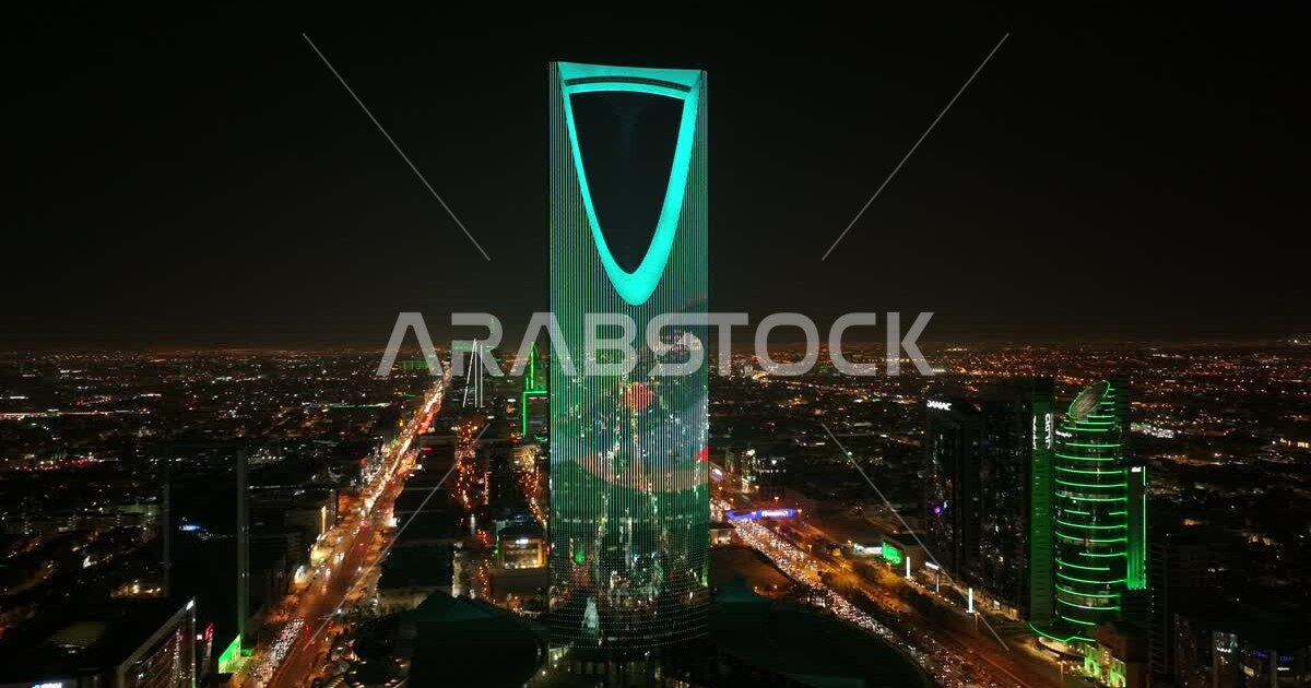 The illuminated Kingdom Tower at night in celebration of the Saudi ...