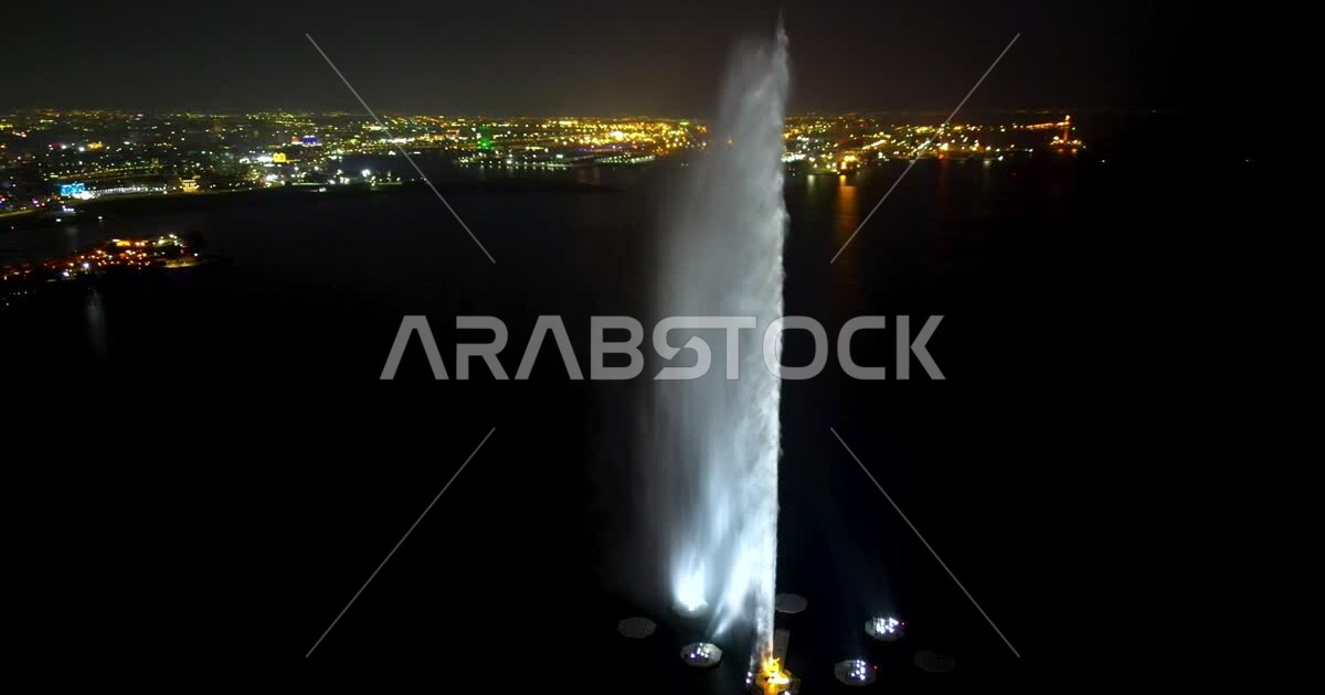 A view of the illuminated city of Jeddah at night, drone photography of ...