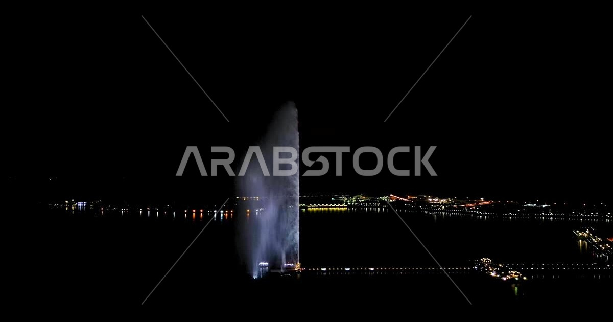 A view of the illuminated city of Jeddah at night, drone photography of ...