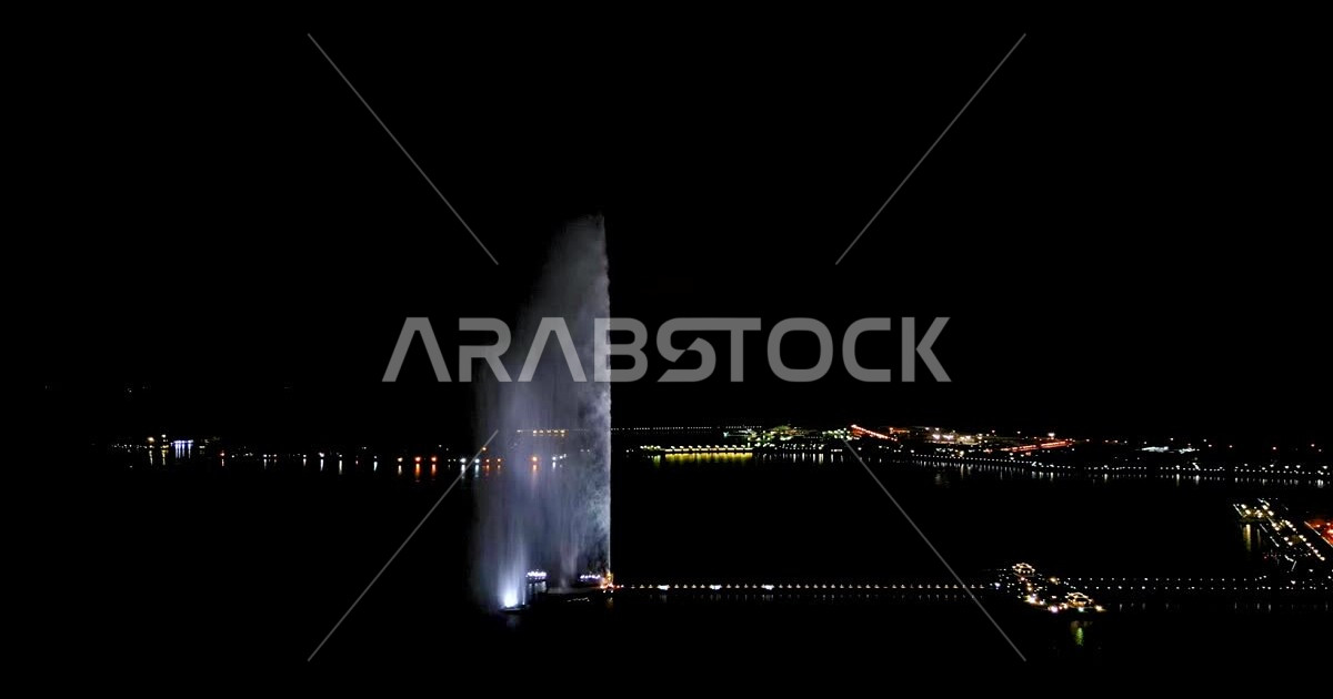 A view of the illuminated city of Jeddah at night, drone photography of ...