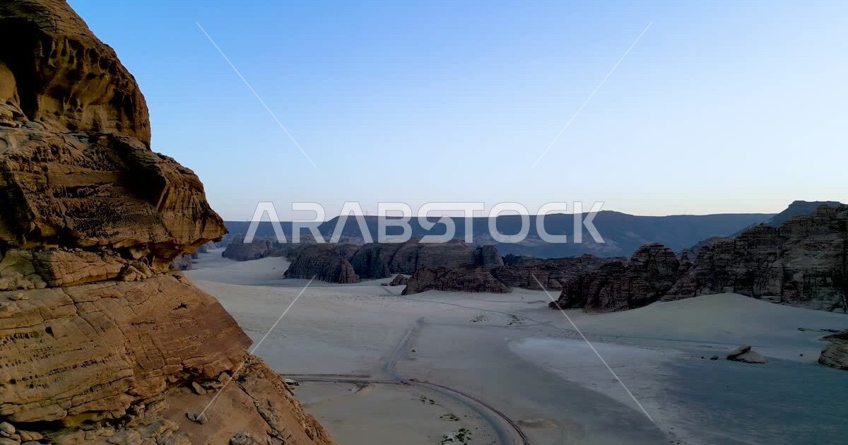 Soft golden sand dunes, terrain and rock formations in the mountain ...