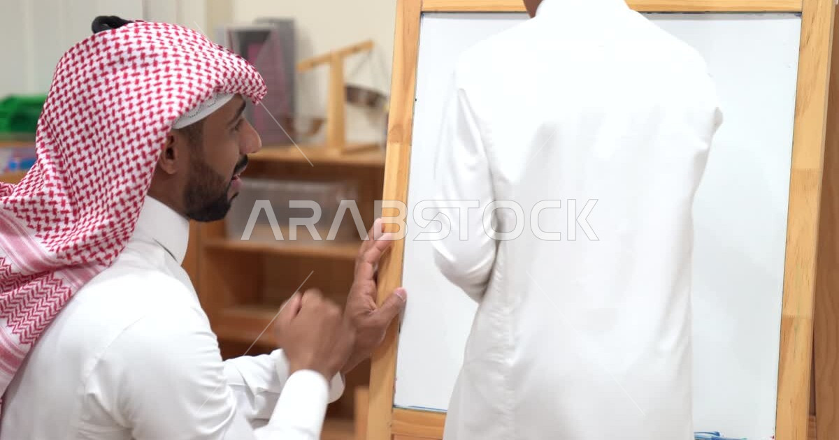 A Saudi Arabian Gulf mathematics teacher explaining simple math ...