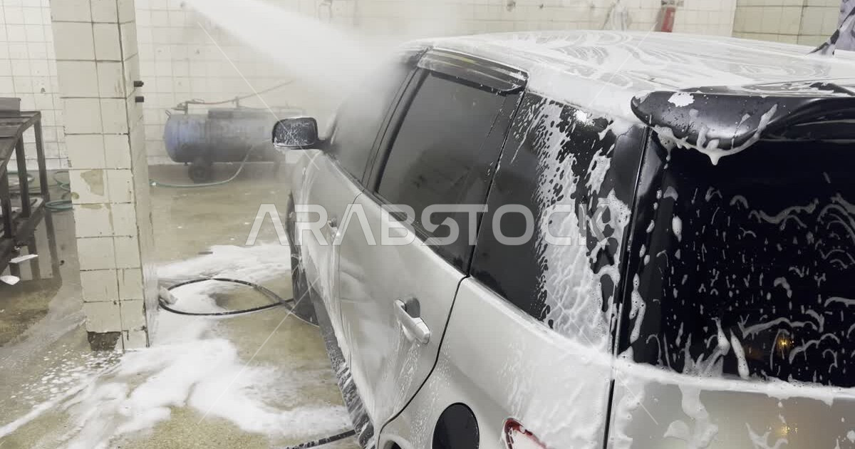 Cleaning soap from cars using Khartoum, car wash station in the Kingdom ...