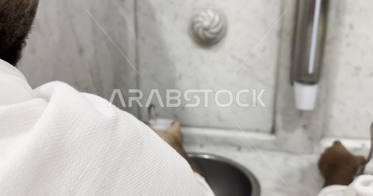 Worship and getting closer to God, a close-up of a pilgrim drinking ...