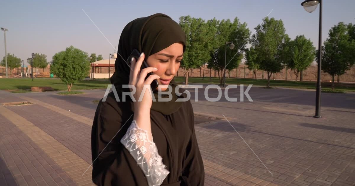 A young Saudi Arabian girl practicing outdoor morning sports, using her ...
