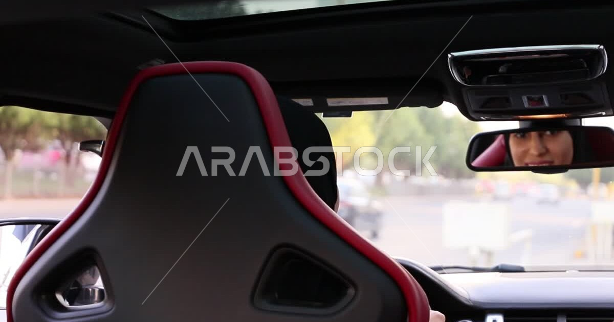 Reflection of the image of a Saudi Arabian Gulf woman in the mirror of ...