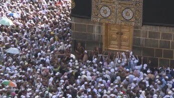 Muslim pilgrims circumambulate around the Holy Kaaba in Mecca, drone ...