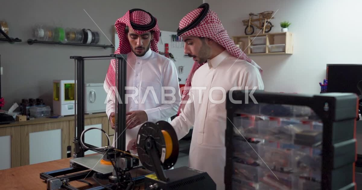 Two young Saudi innovators use a 3D printer to manufacture a product ...