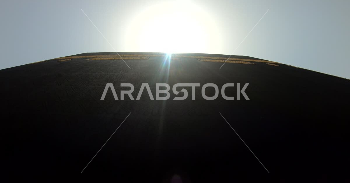 The black silk covering of the Kaaba engraved with golden Qur’anic ...