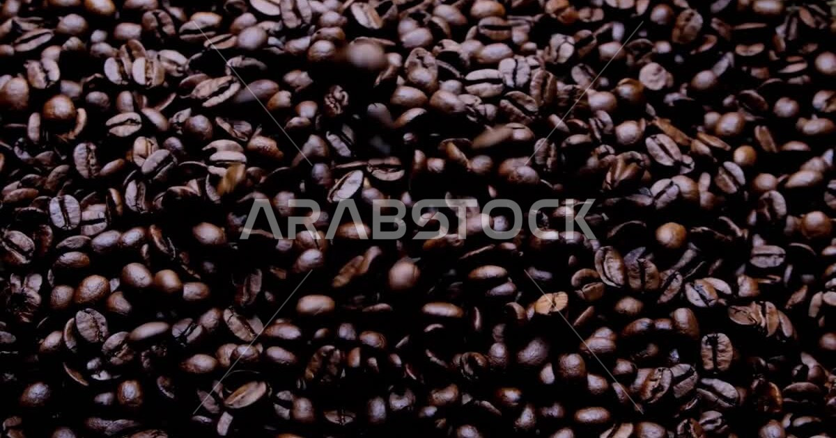 Arabian coffee beans, close-up depiction of falling roasted coffee ...